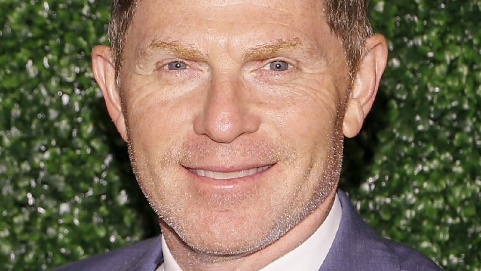 Bobby Flay's Pro Tip For Poaching Eggs