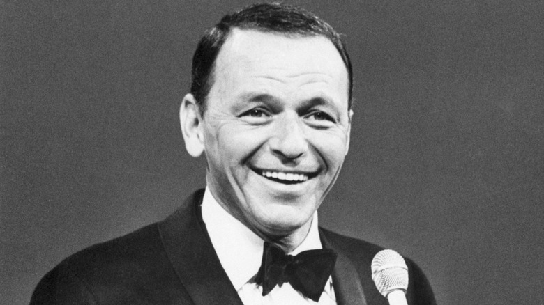 Frank Sinatra holding microphone